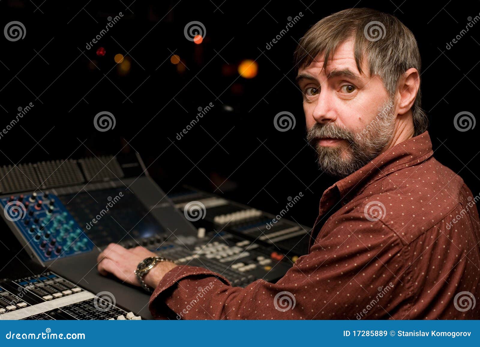 Sound Engineer Music Producer Adjusting And Balancing Audio On Rock ...