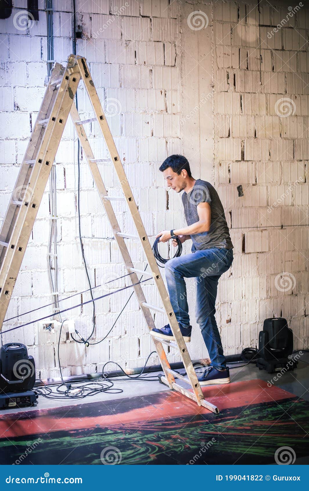 Sound Engineer is Connecting the Audio Cables in the Theater Stock ...