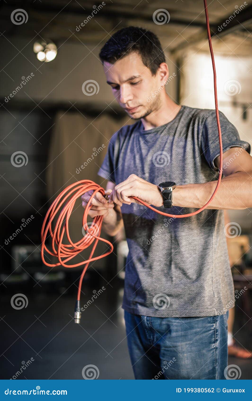 Sound Engineer is Connecting the Audio Cables in the Theater Stock ...