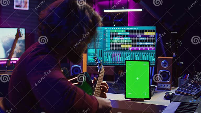 Sound Engineer Practices Playing Acoustic Guitar Using Learning App ...