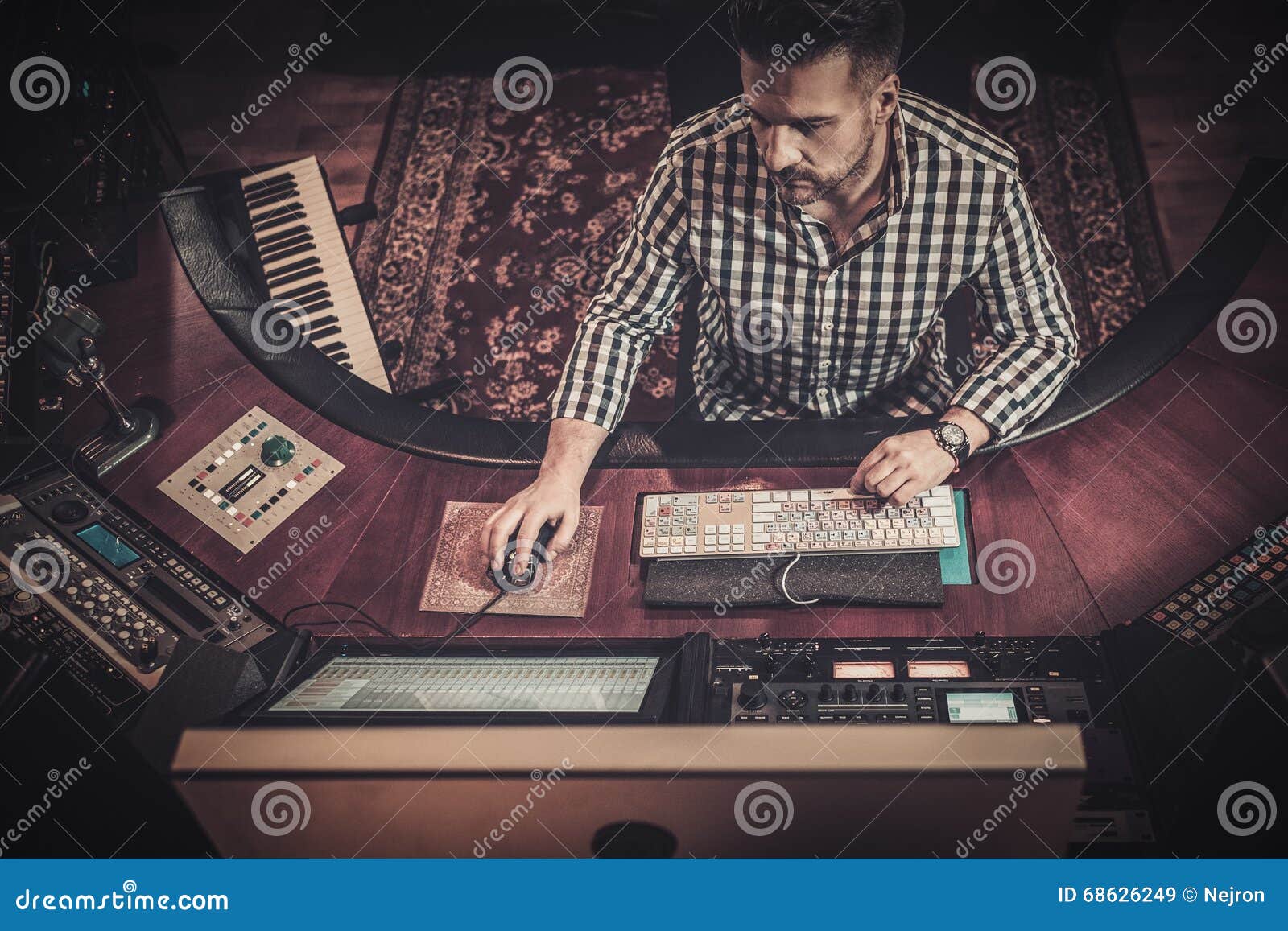 Sound Engineer Working at Mixing Panel in the Boutique Recording Studio ...