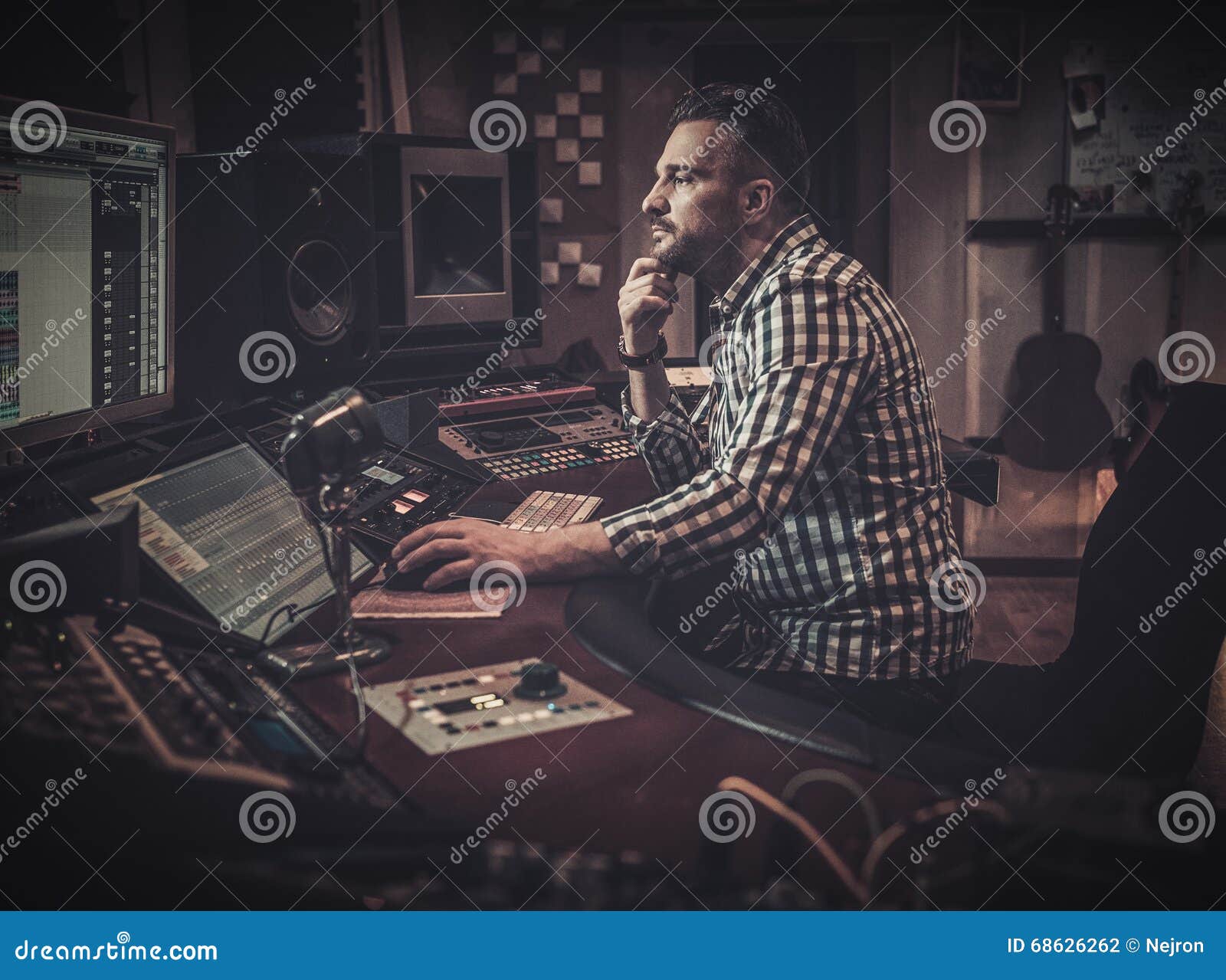 Sound Engineer Working at Mixing Panel in the Boutique Recording Studio ...