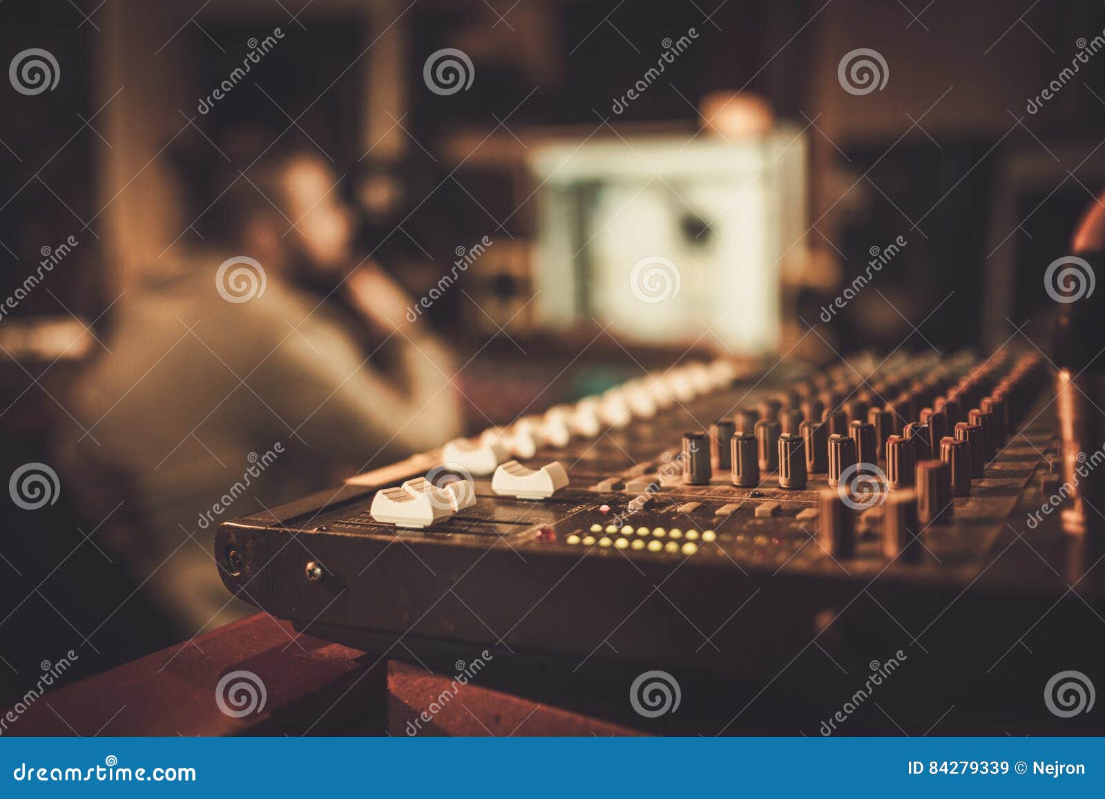 Sound Engineer Working at Mixing Panel in the Boutique Recording Studio ...