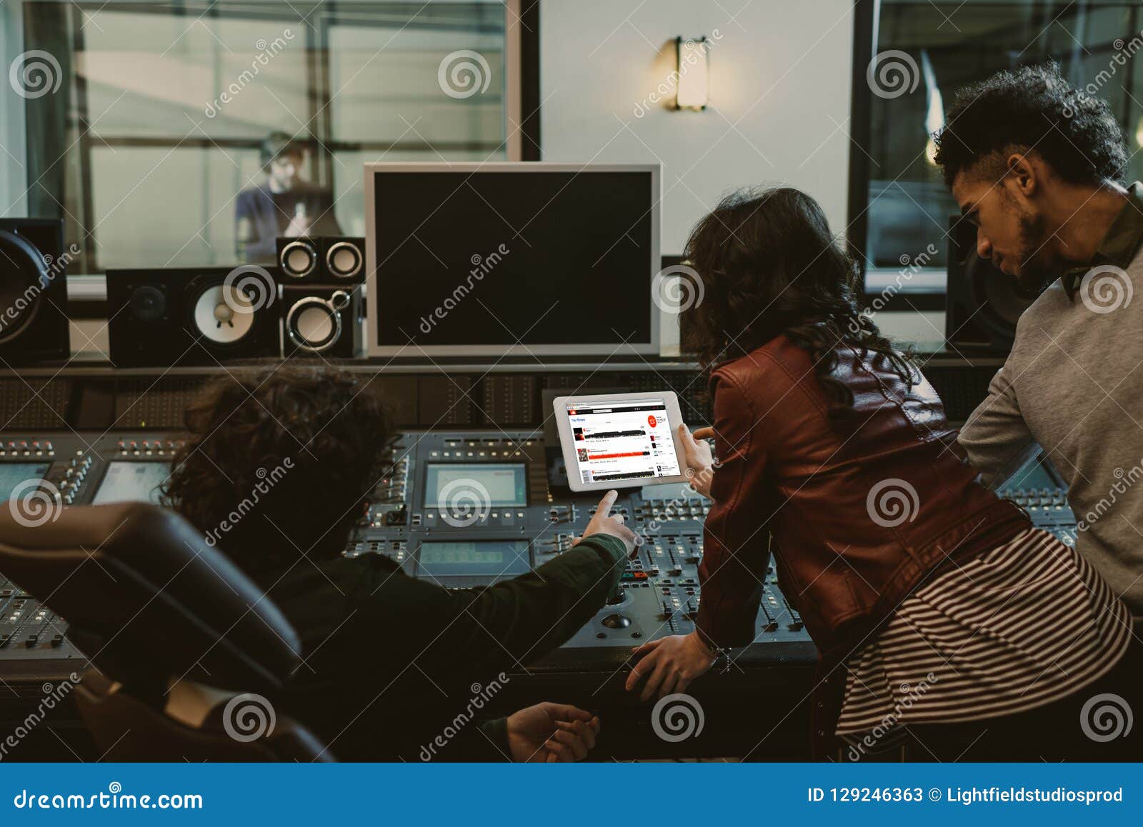 Sound Producers Using Tablet Together at Recording Studio with ...