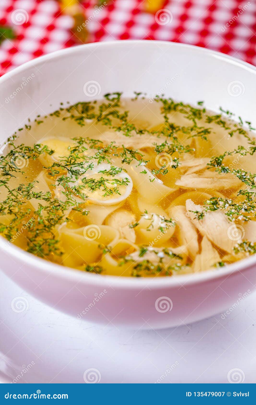 Soup with Chicken, Quail Egg and Pasta in White Bowl Stock Image ...