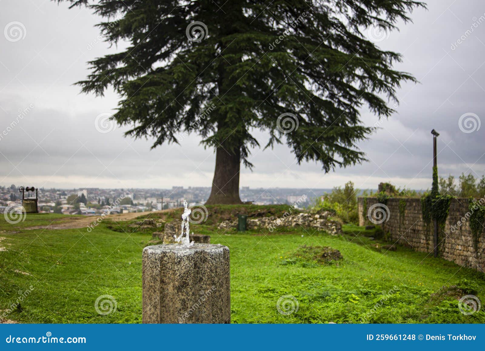 A Source of Drinking Water from a Natural Stone Tap, Against the ...