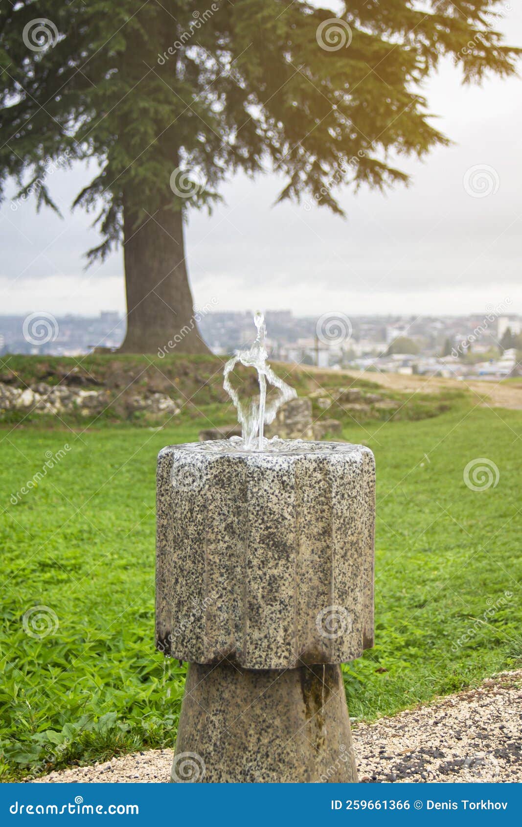 A Source of Drinking Water from a Natural Stone Tap, Against the ...
