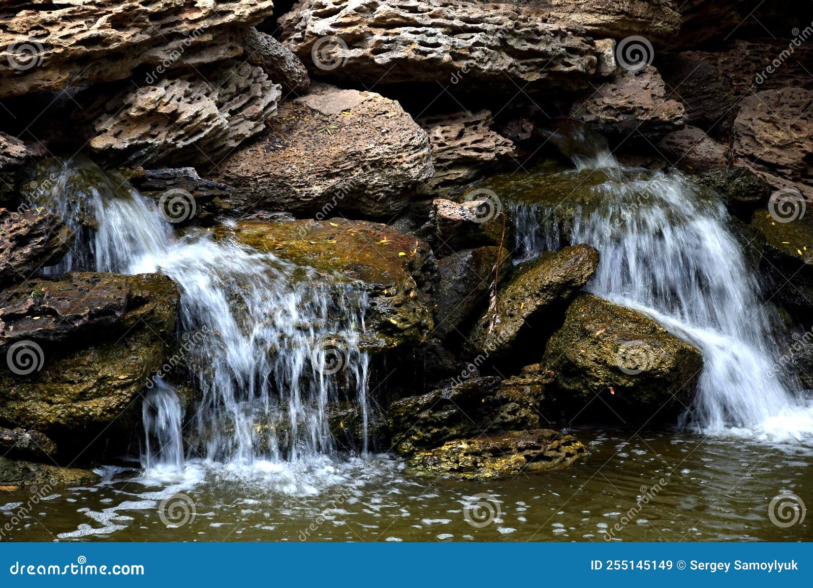 Small Waterfalls Pour from a Stone Pile in the Park Stock Image - Image ...