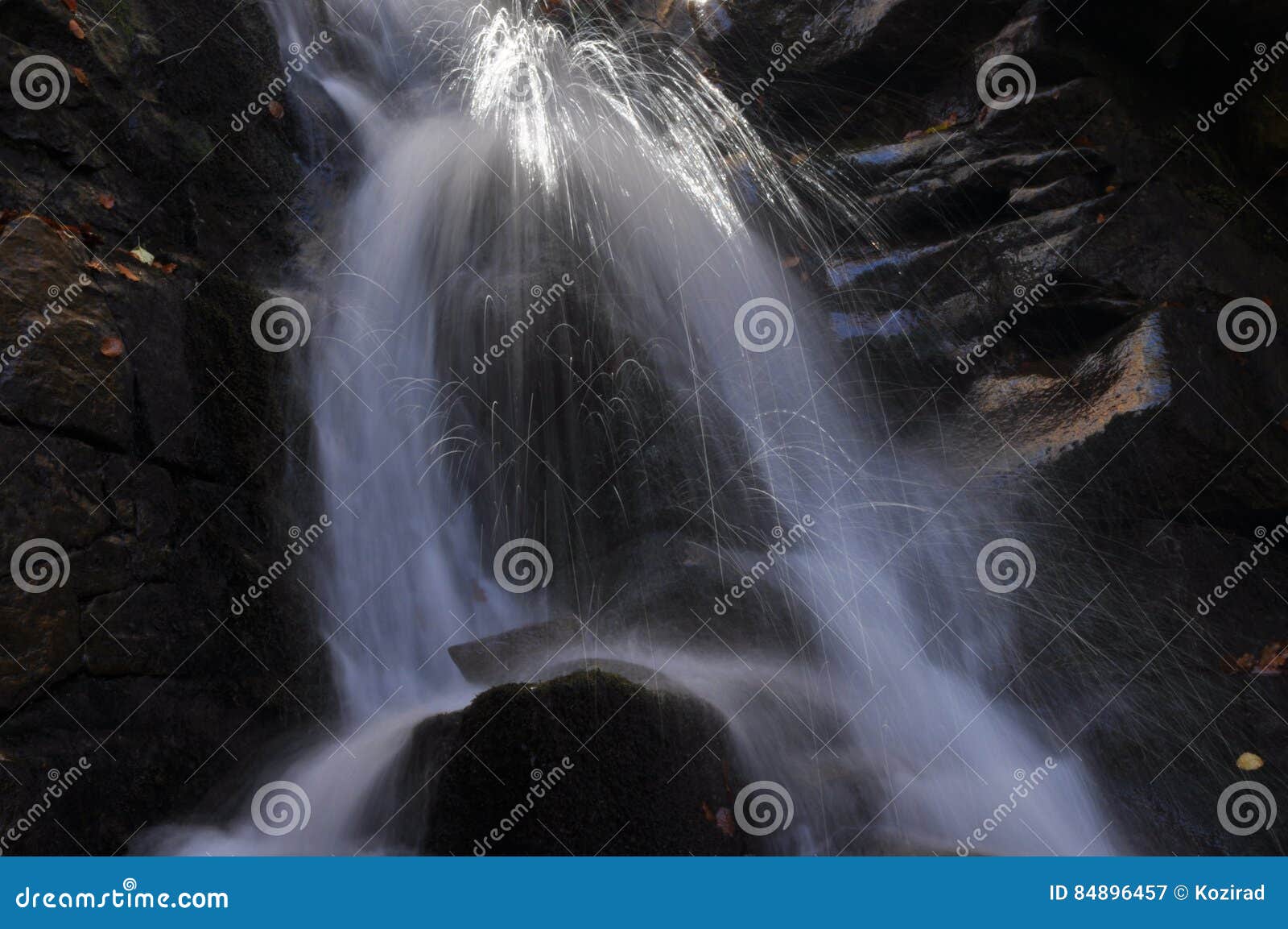 A Stream Of Clean Drinking Water Flows Into A Transparent Glass. Black ...