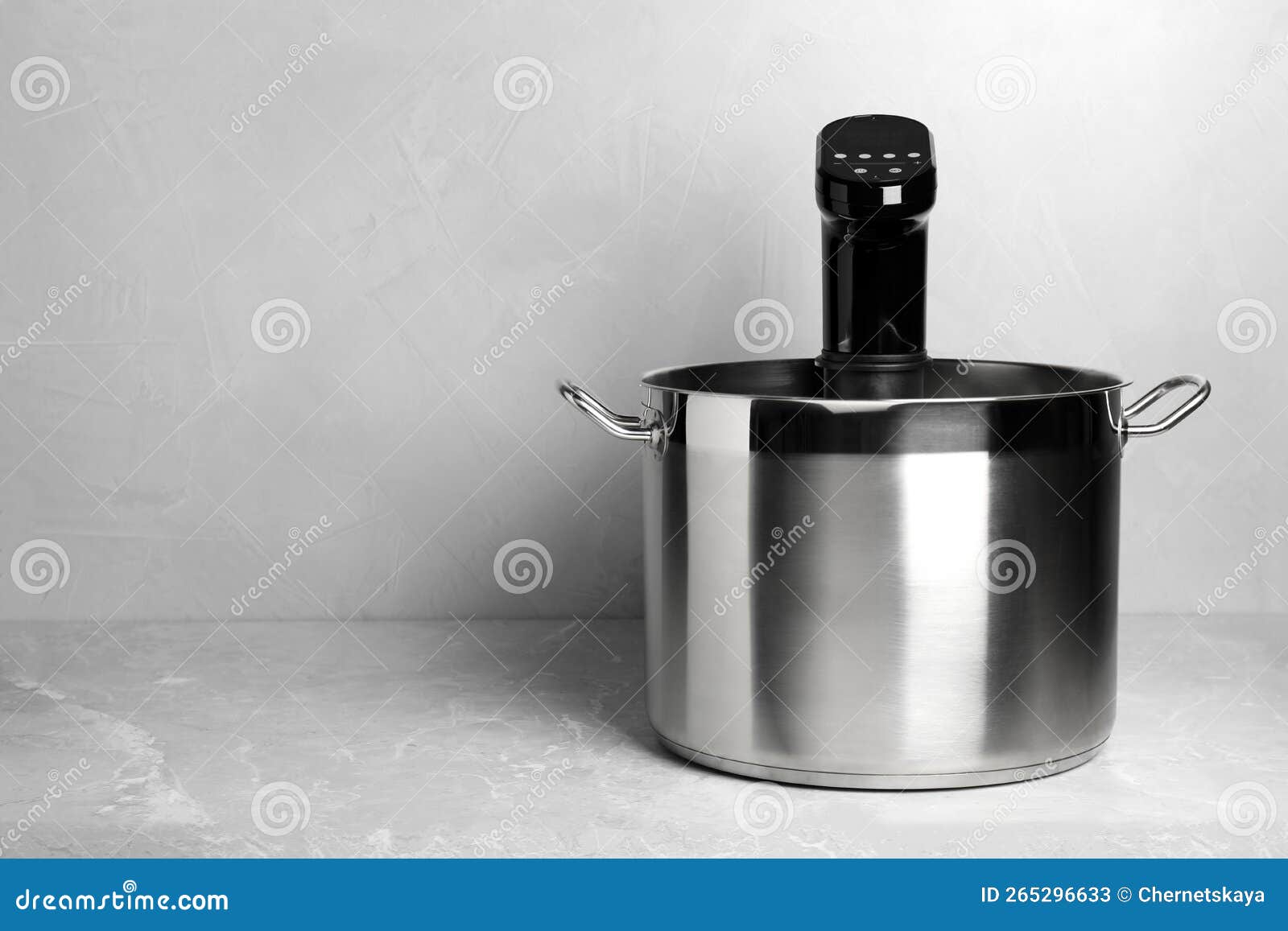 Sous Vide Cooker in Pot on Light Grey Table, Space for Text. Thermal ...