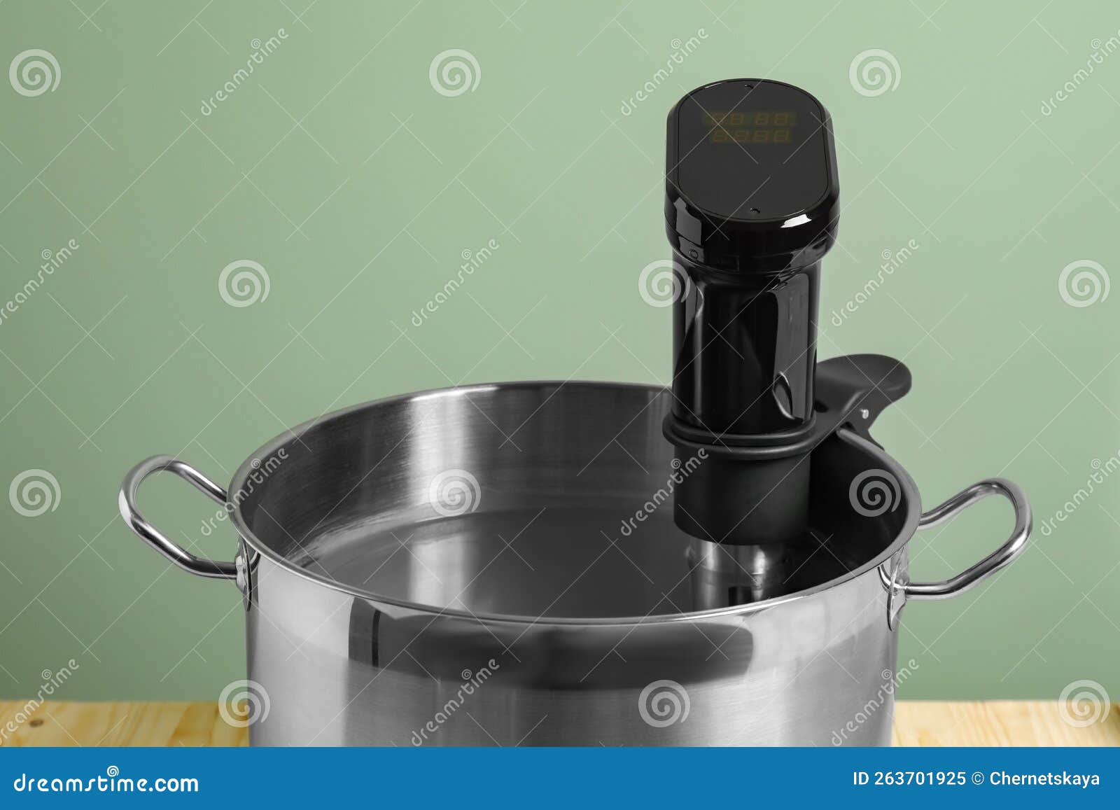 Sous Vide Cooker in Pot on Table, Closeup. Thermal Immersion Circulator ...
