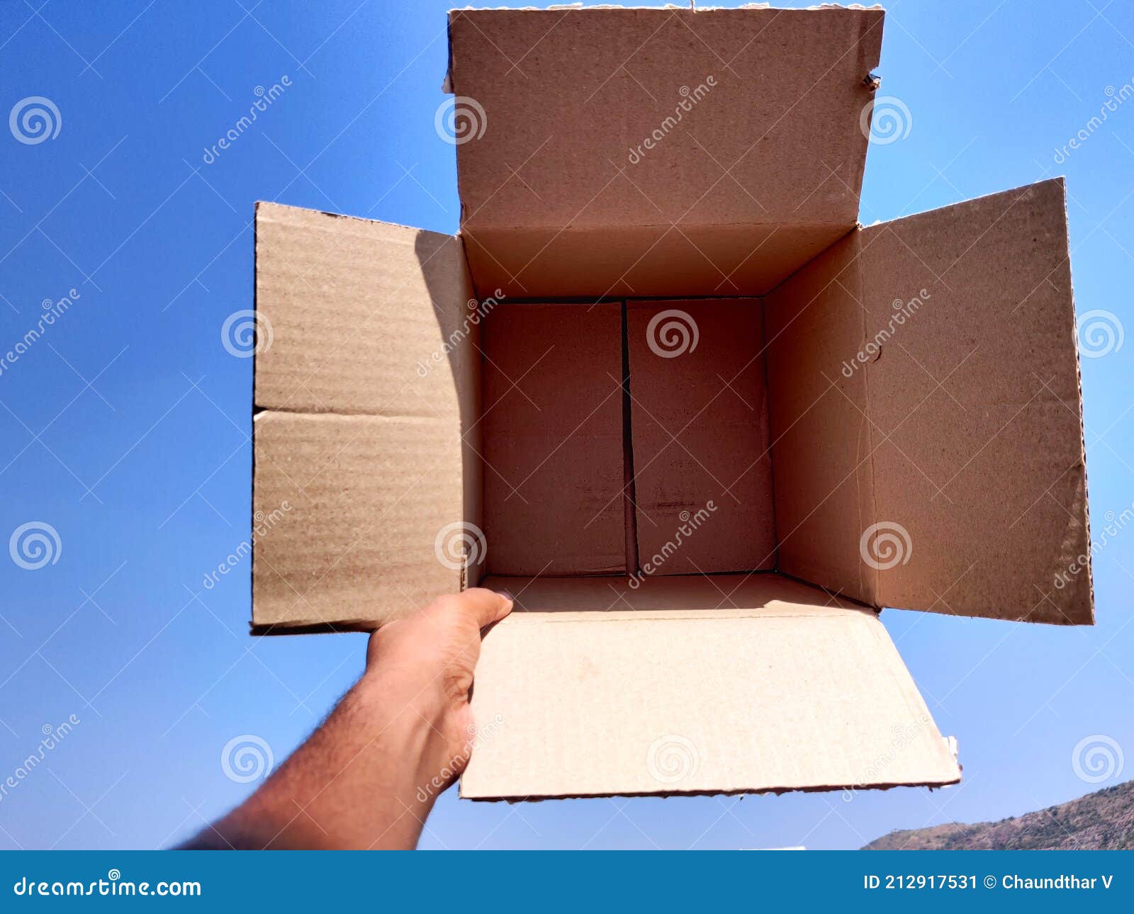 South Indian Man Hand Holding Empty Brown Box. Stock Image - Image of ...