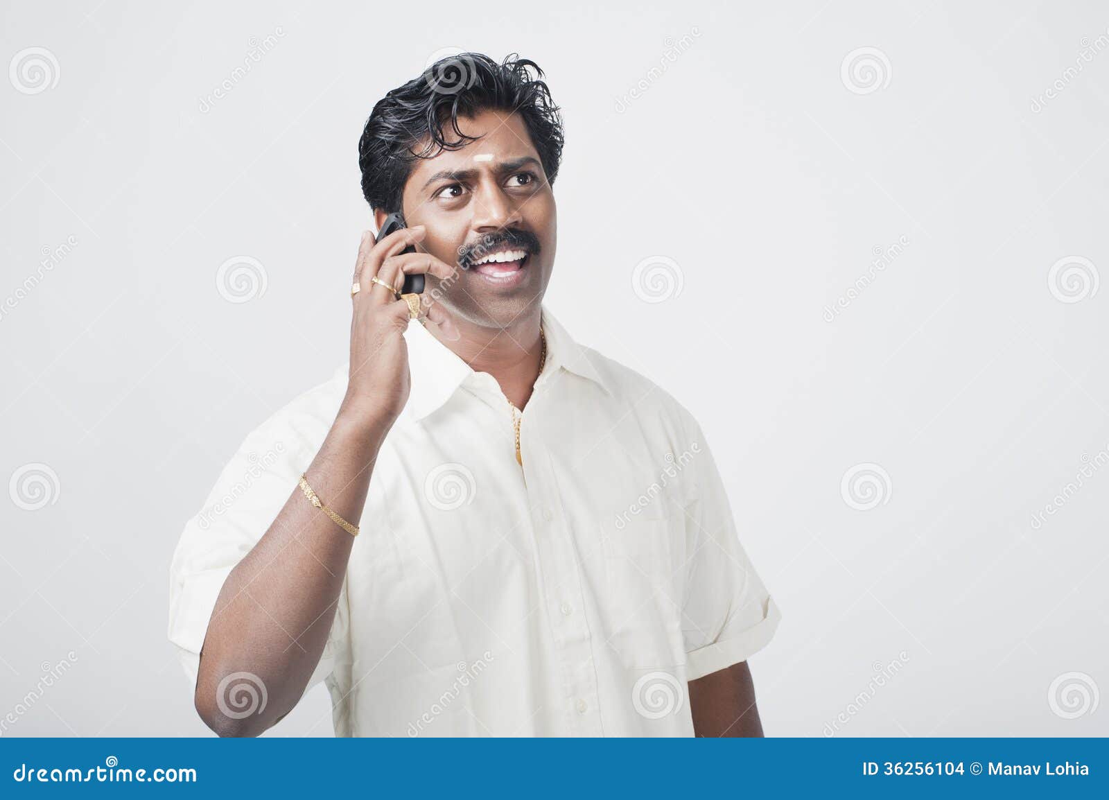 South Indian Man Talking on a Mobile Phone Stock Photo - Image of ...