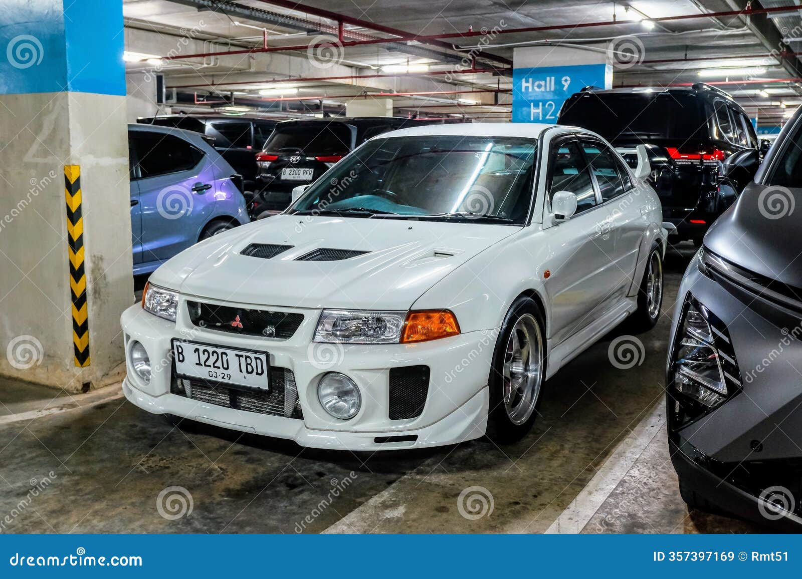 White Mitsubishi Lancer Evolution V in Indonesia Modification Expo 2024 ...