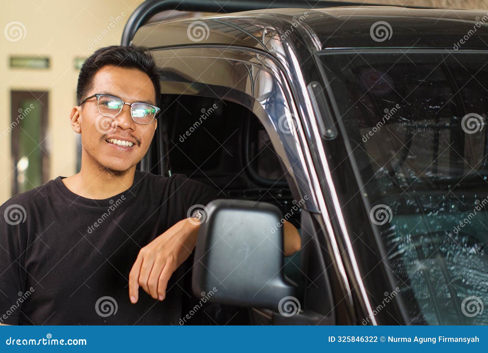 An Southeast Asian Transport Worker Leaning on the Pick Up and Smiling ...