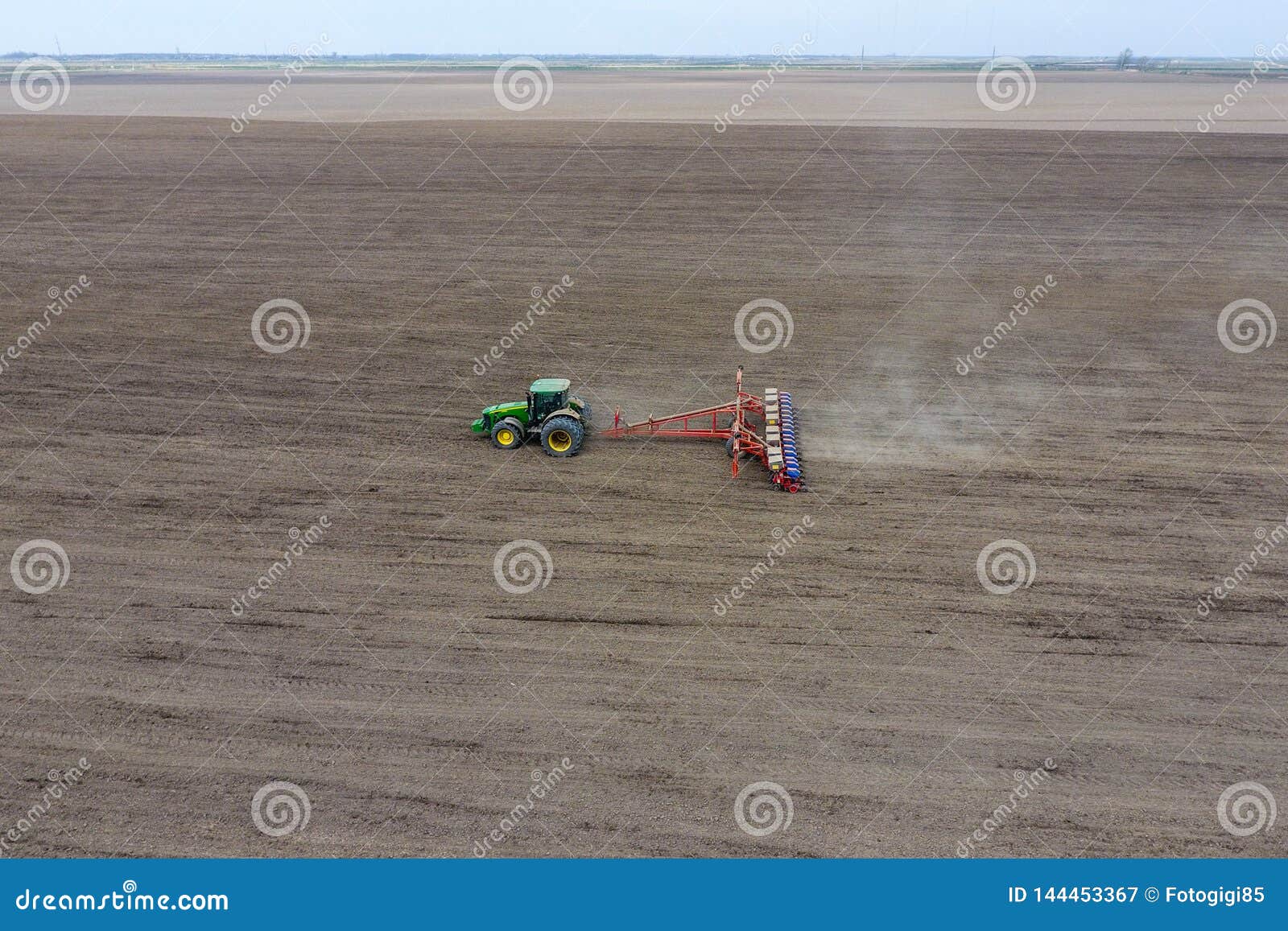 Sowing of Corn. Tractor with a Seeder on the Field Stock Image - Image ...