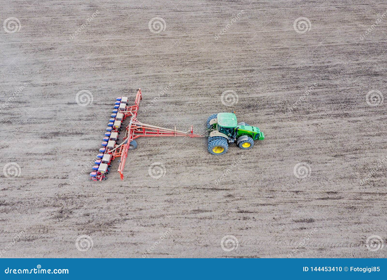 Sowing of Corn. Tractor with a Seeder on the Field Editorial Image ...