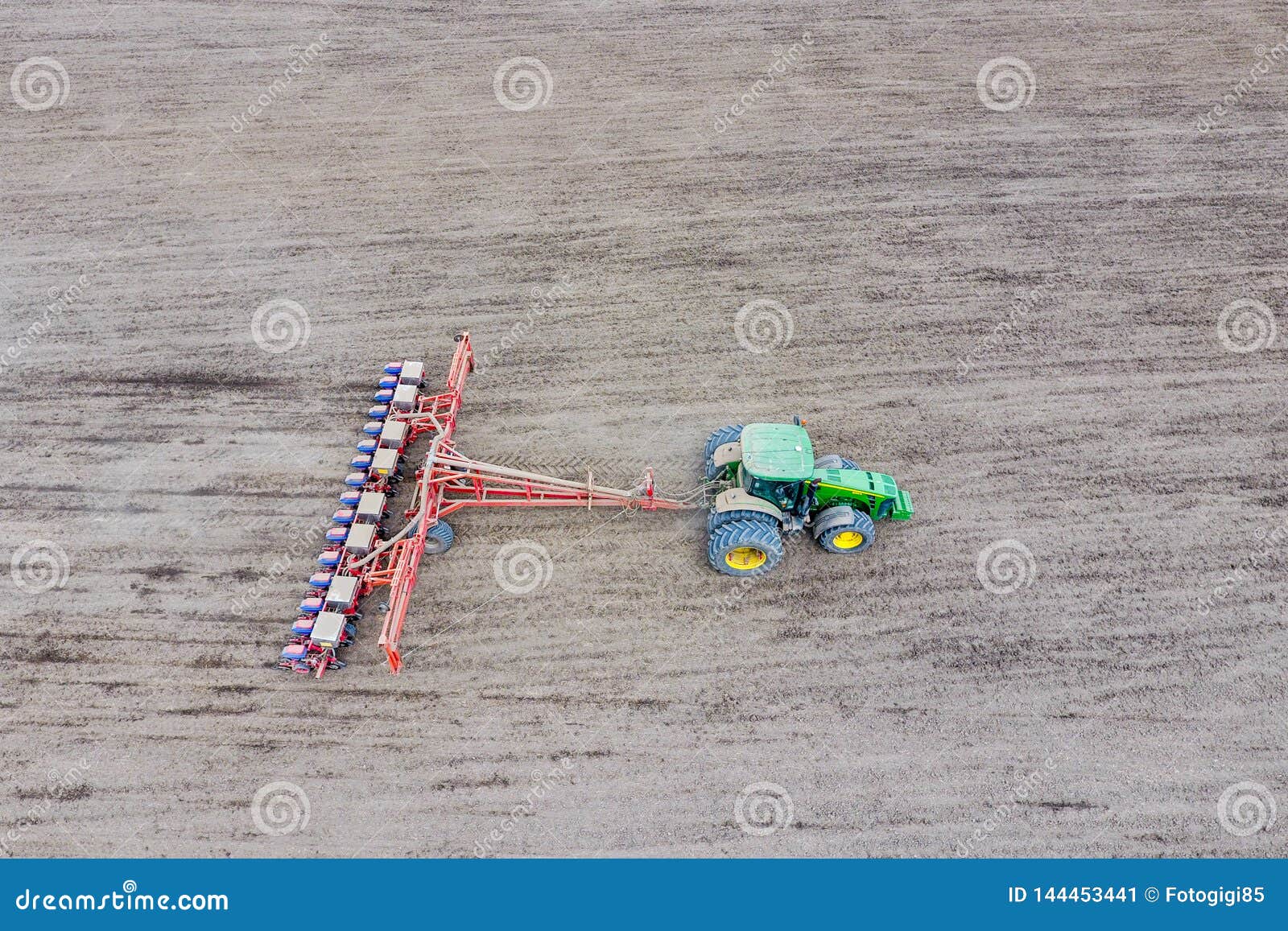 Sowing of Corn. Tractor with a Seeder on the Field Editorial Photo ...