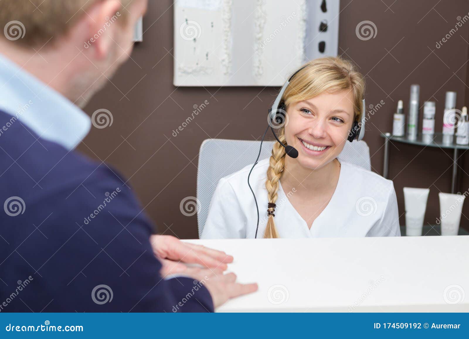 Spa Receptionist Smiling To Client Stock Photo - Image of warm, service ...