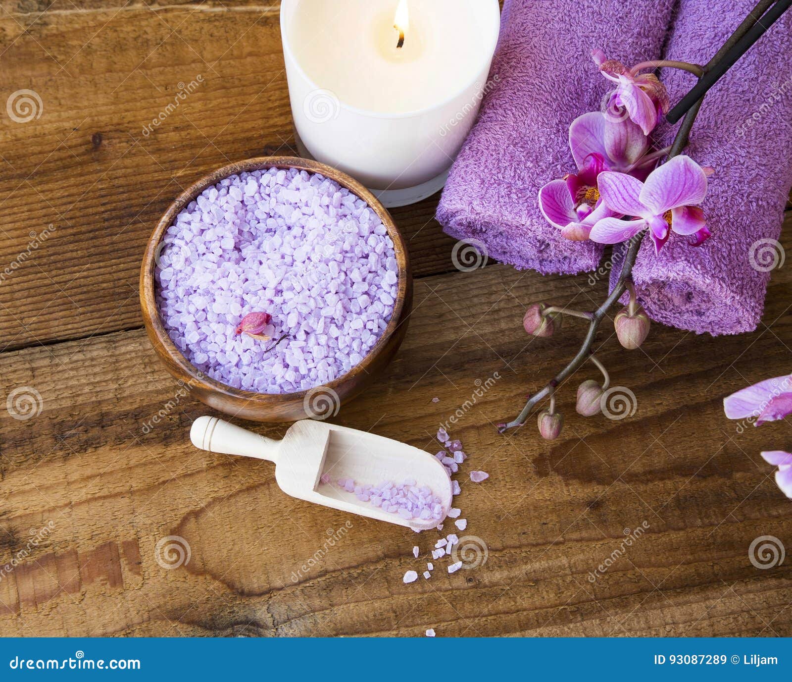 Spa Setting With Bath Salt Orchid Candle Towels And On Wooden Board