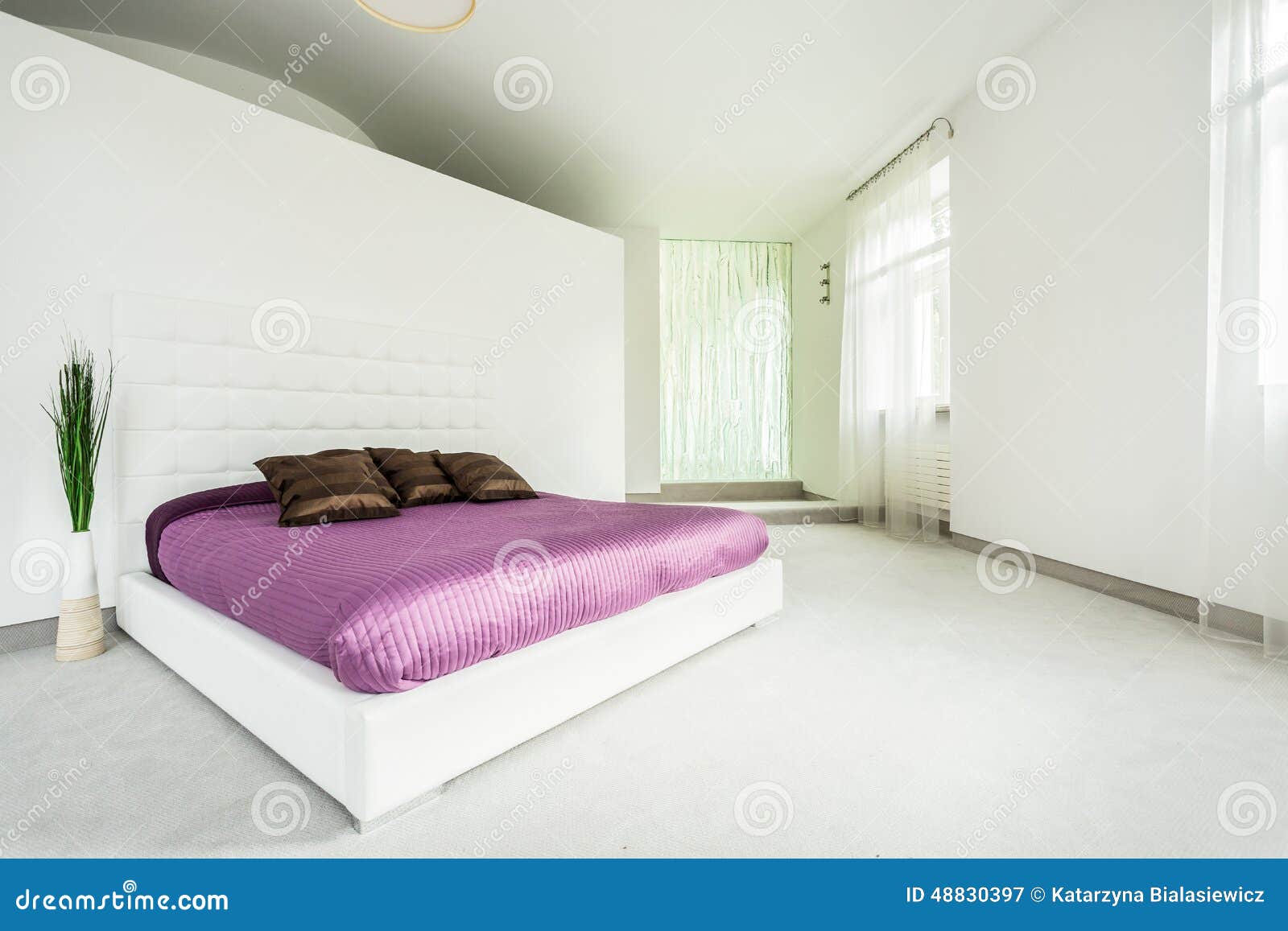 Spacious Bed in Elegant Bedroom Stock Image - Image of flower, comfort ...