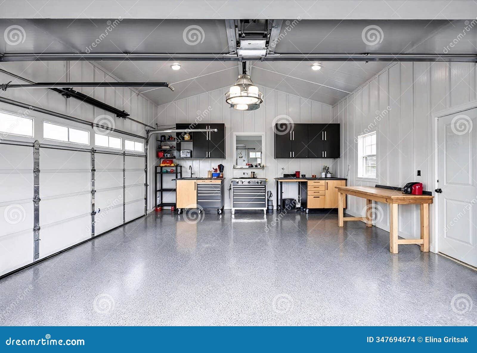 Spacious Garage Interior with Modern Storage Solutions, Workbench, and Efficient Lighting for a ...