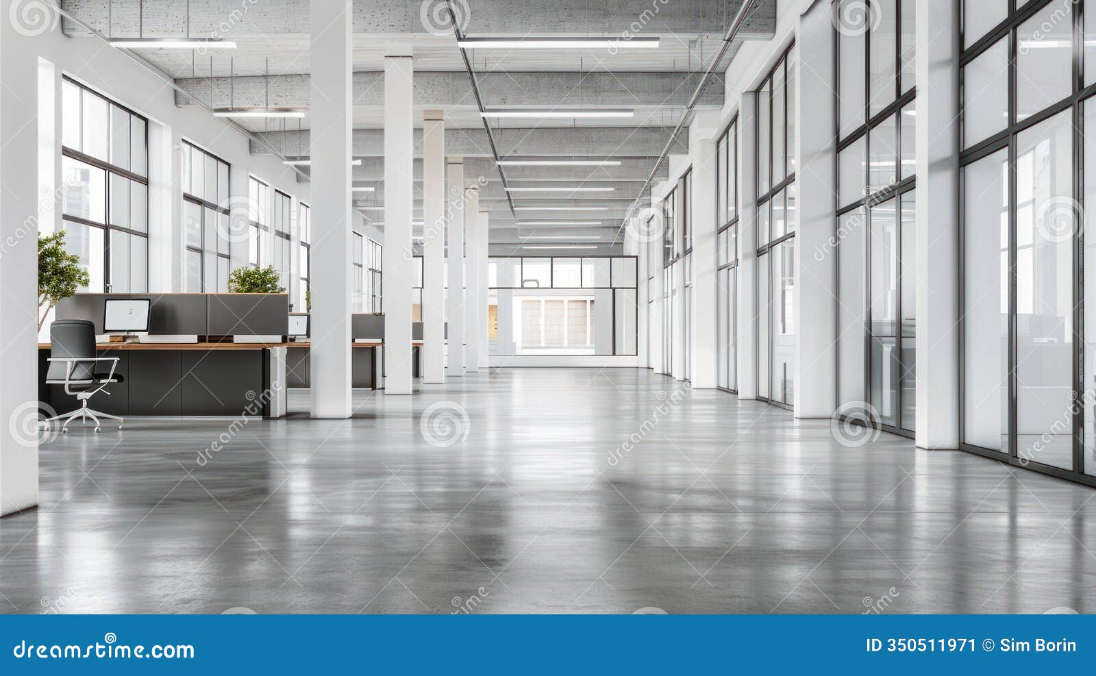 A Spacious Office Aisle with Desks and Workstations on Either Stock ...