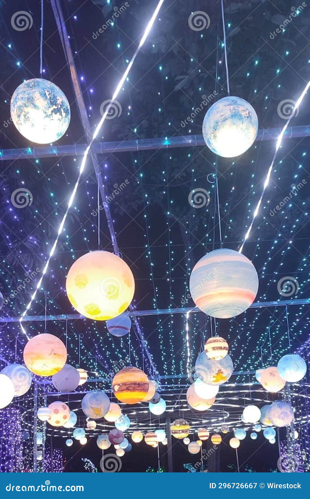 A Room Filled with Lots of Lights in the Air, and There is Lit Ceiling ...