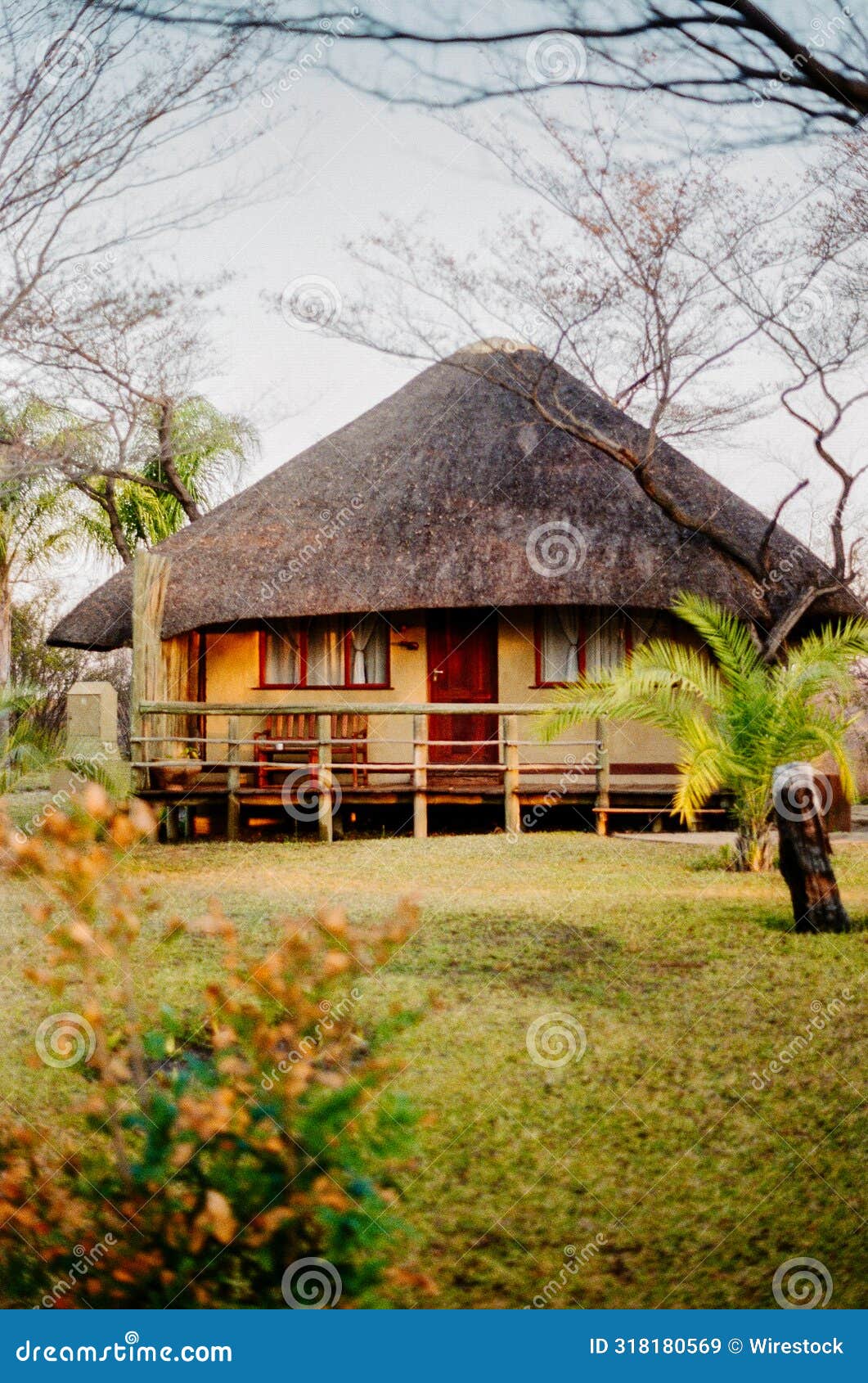 Spacious Thatched Structure with a Wooden Front Porch. Stock Image ...