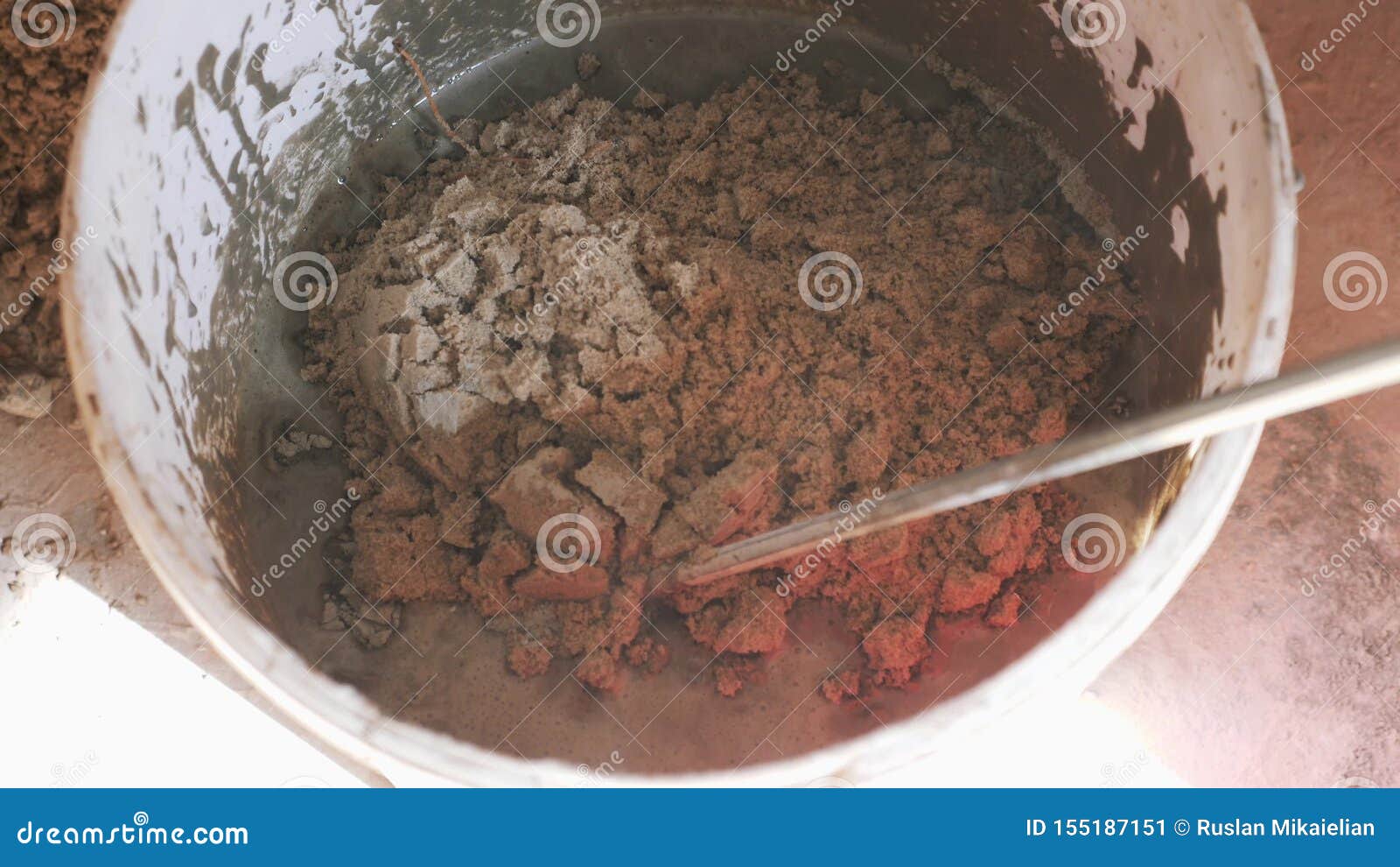 Spade Digging Sand in Front of Brick Wall. Professional Craftsmen Digs ...