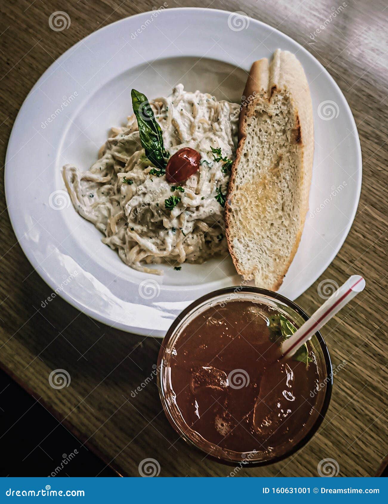 Spaghetti Alfredo with Ice Tea Stock Image - Image of alfredo ...