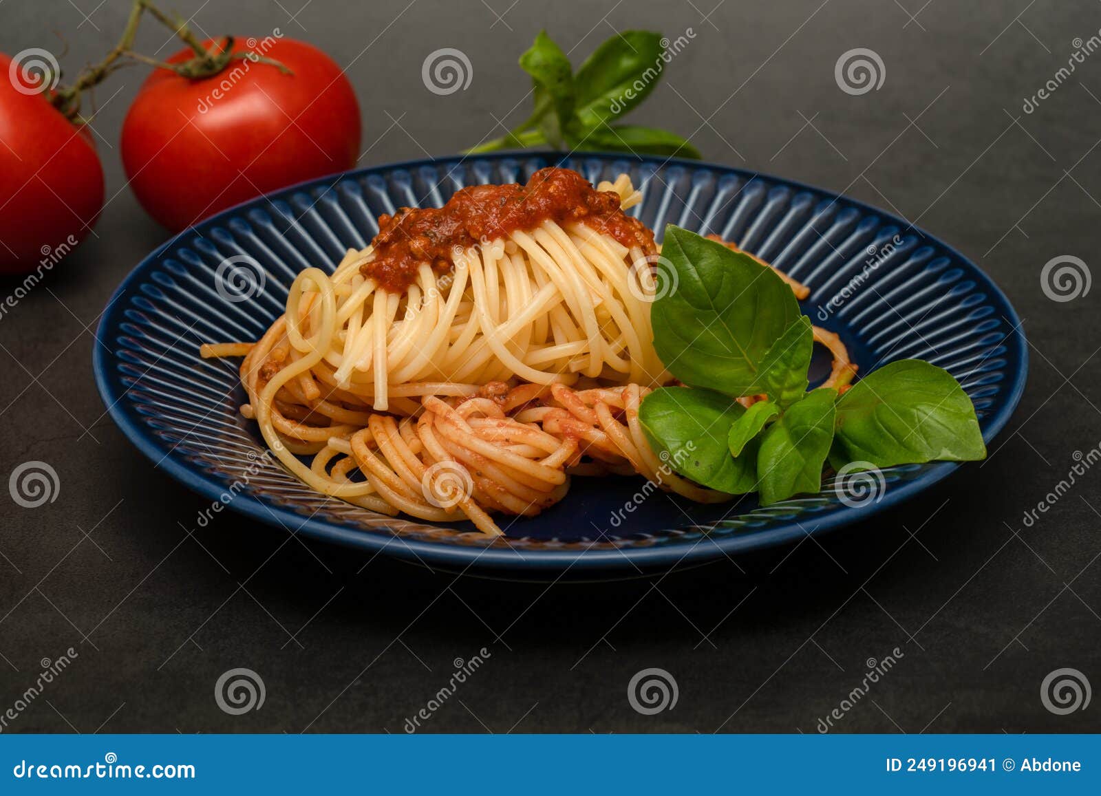 Spaghetti on a Blue Plate with Basil Stock Image - Image of blue ...