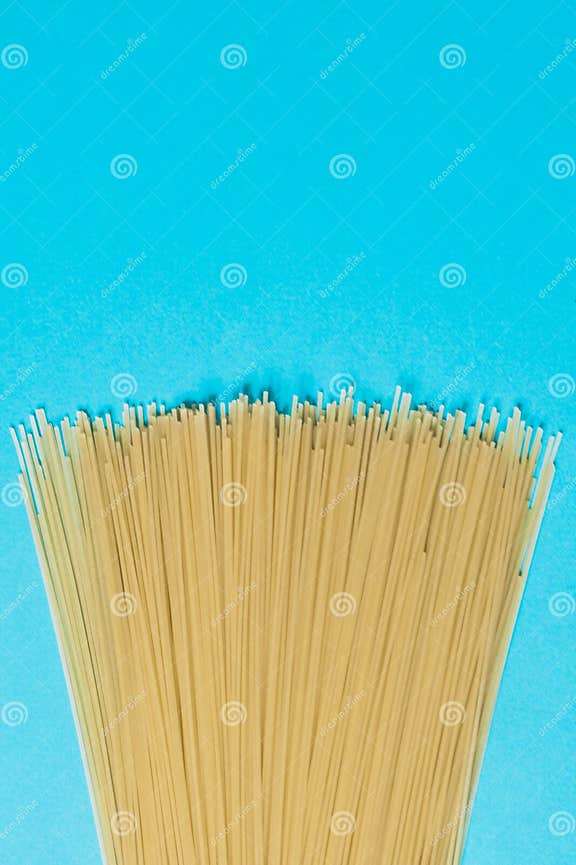 Spaghetti on a Blue Background. Stock Photo - Image of italian ...