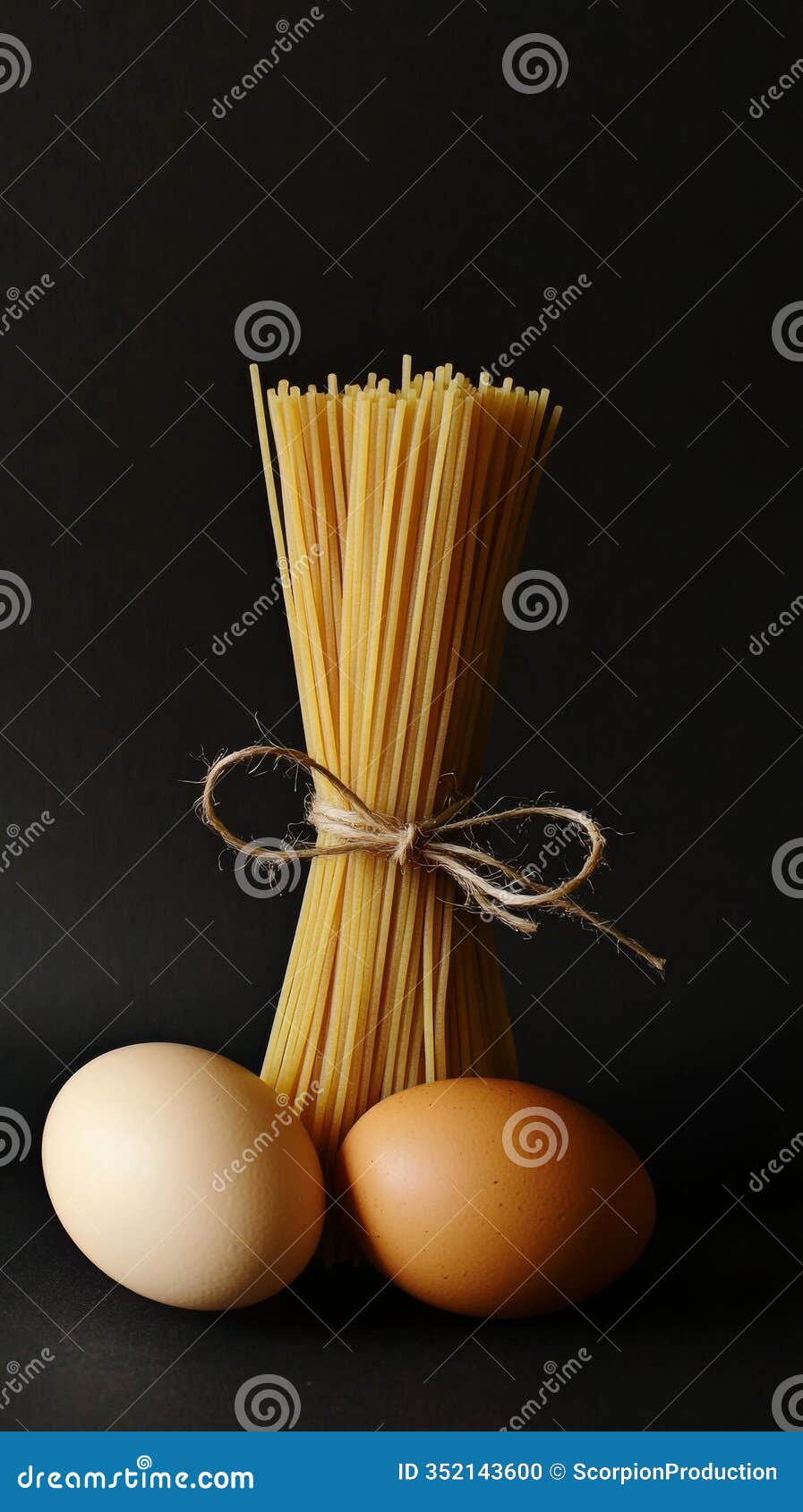 Spaghetti Bundle with Eggs Against a Dark Backdrop Stock Photo - Image ...