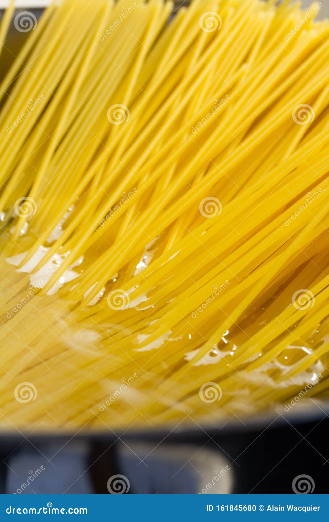 Spaghetti in boiling water stock photo. Image of food - 161845680