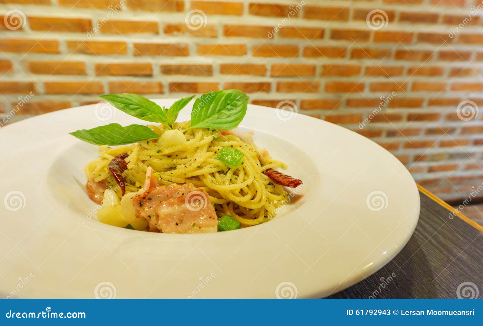 Spaghetti in Dish Put on the Table with Brick Wall at Restaurant Stock ...