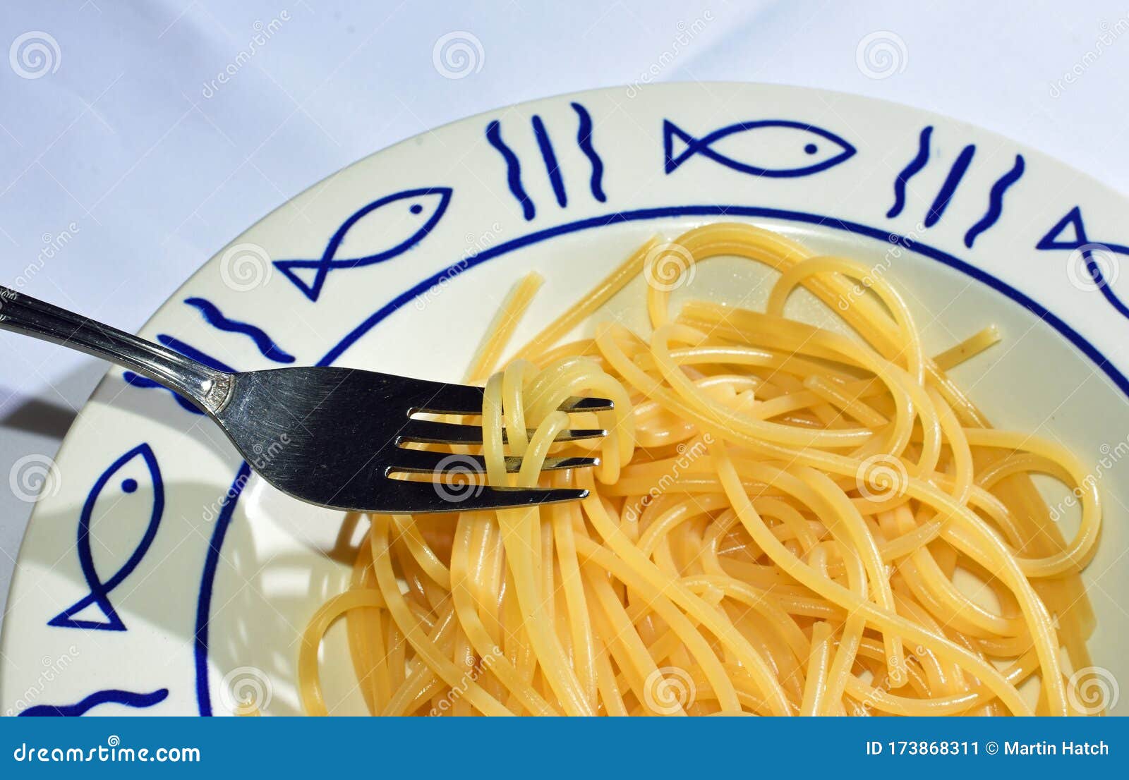 Spaghetti with Folk on Plate with Fish Design. Stock Image - Image of ...