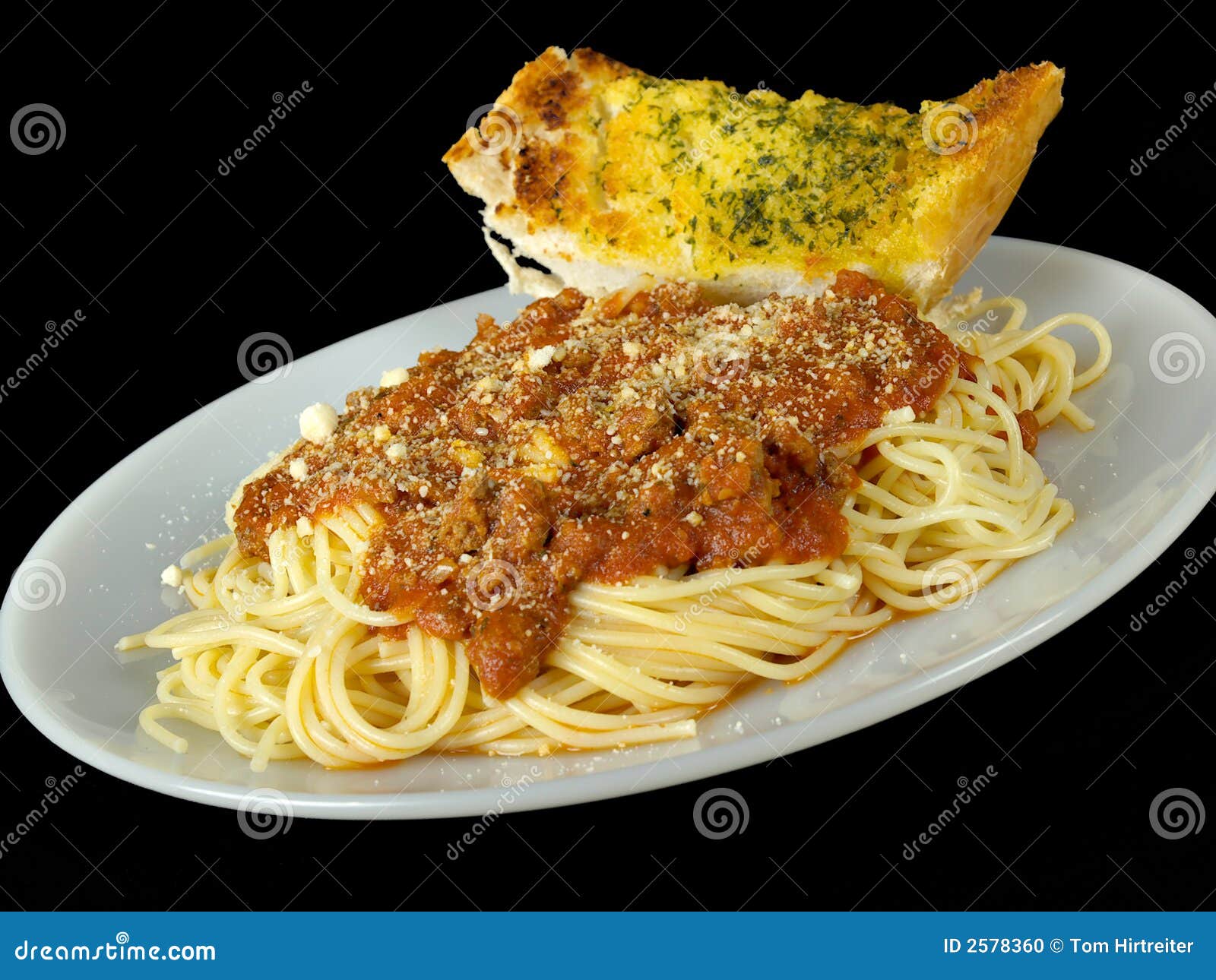 Spaghetti and Garlic Bread stock photo. Image of black - 2578360