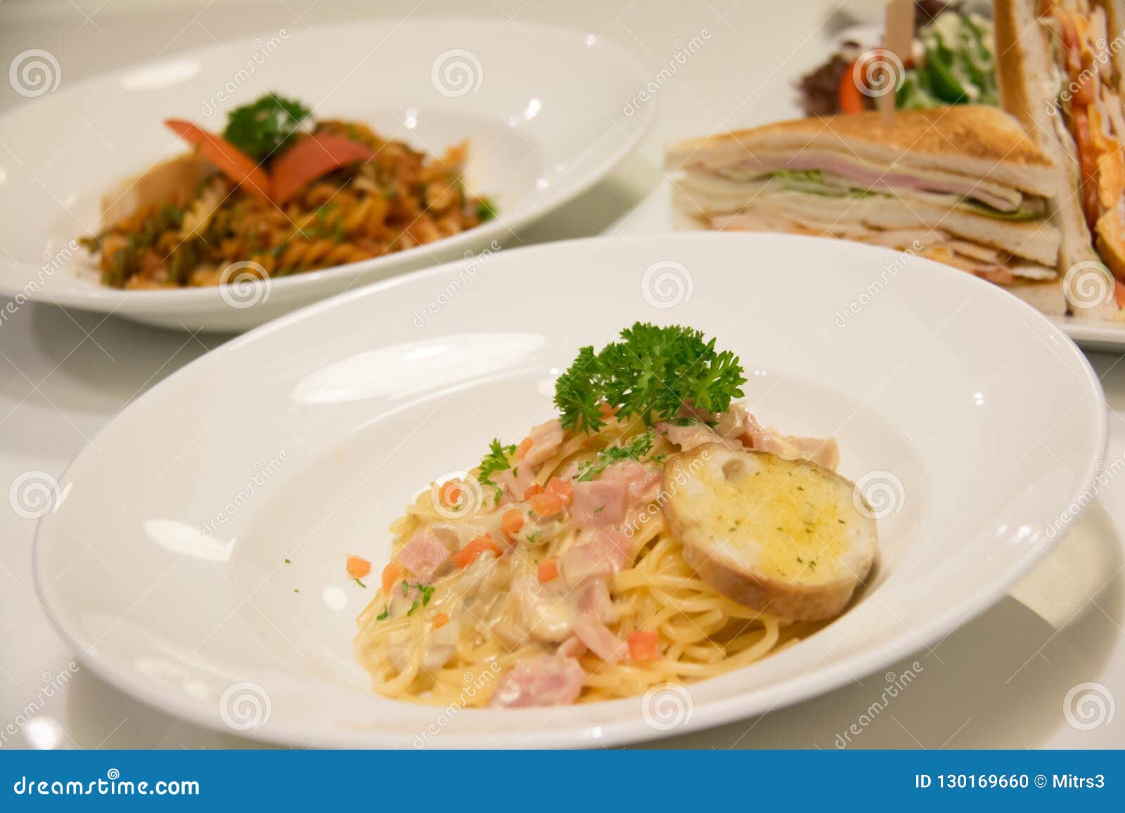 Spaghetti with Ham and Pasta Sauce on Table Stock Photo - Image of ...