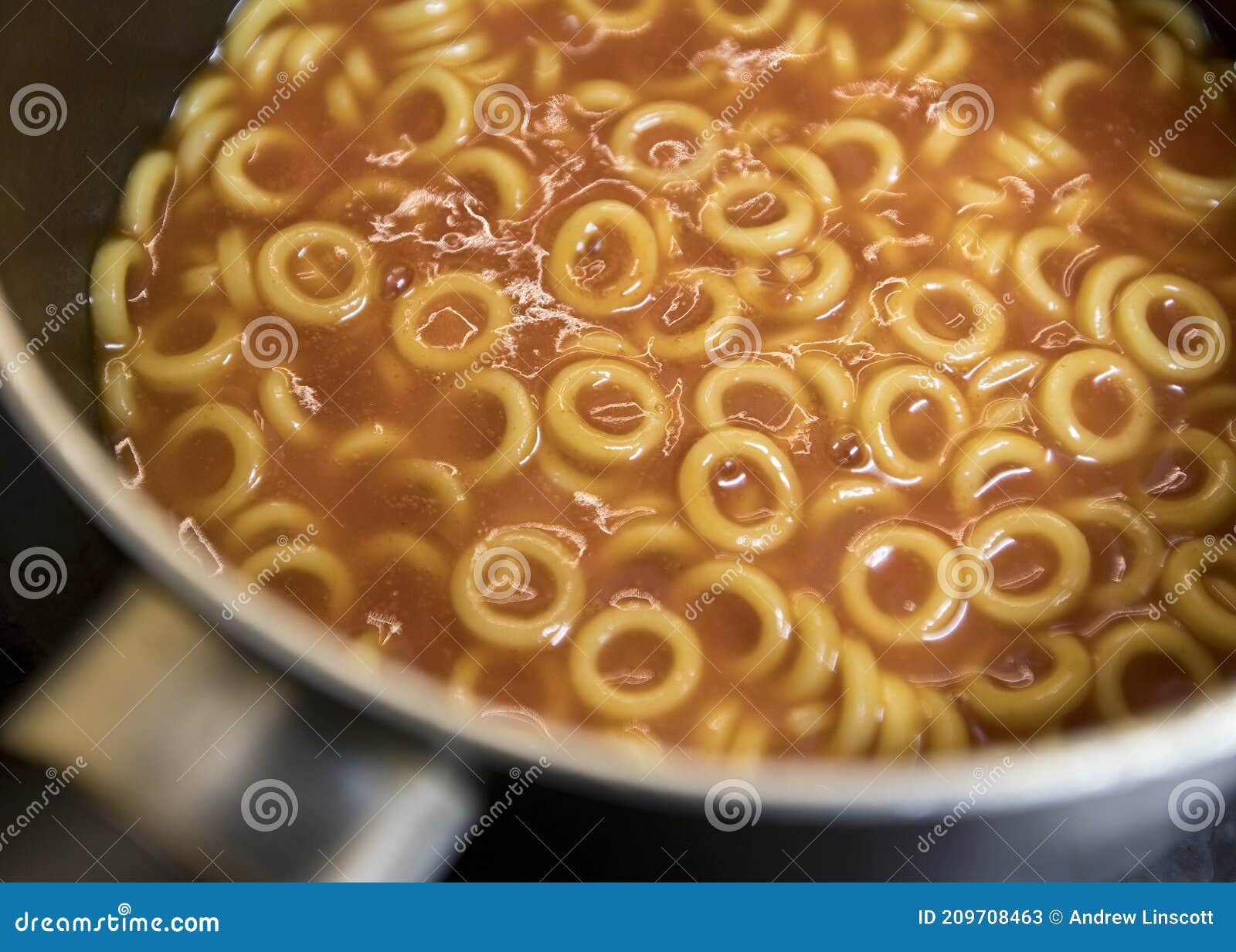 Spaghetti hoops in a pan stock image. Image of spaghetti - 209708463