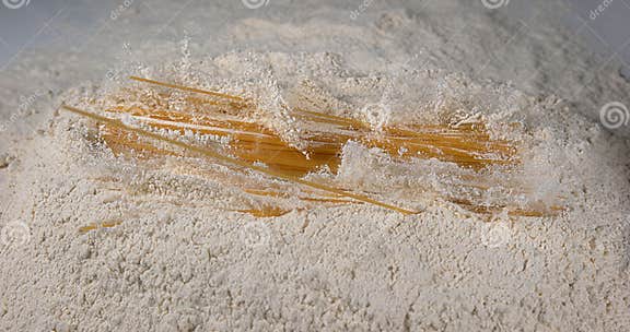 Spaghetti Pasta Falling on Flour Stock Image - Image of food ...