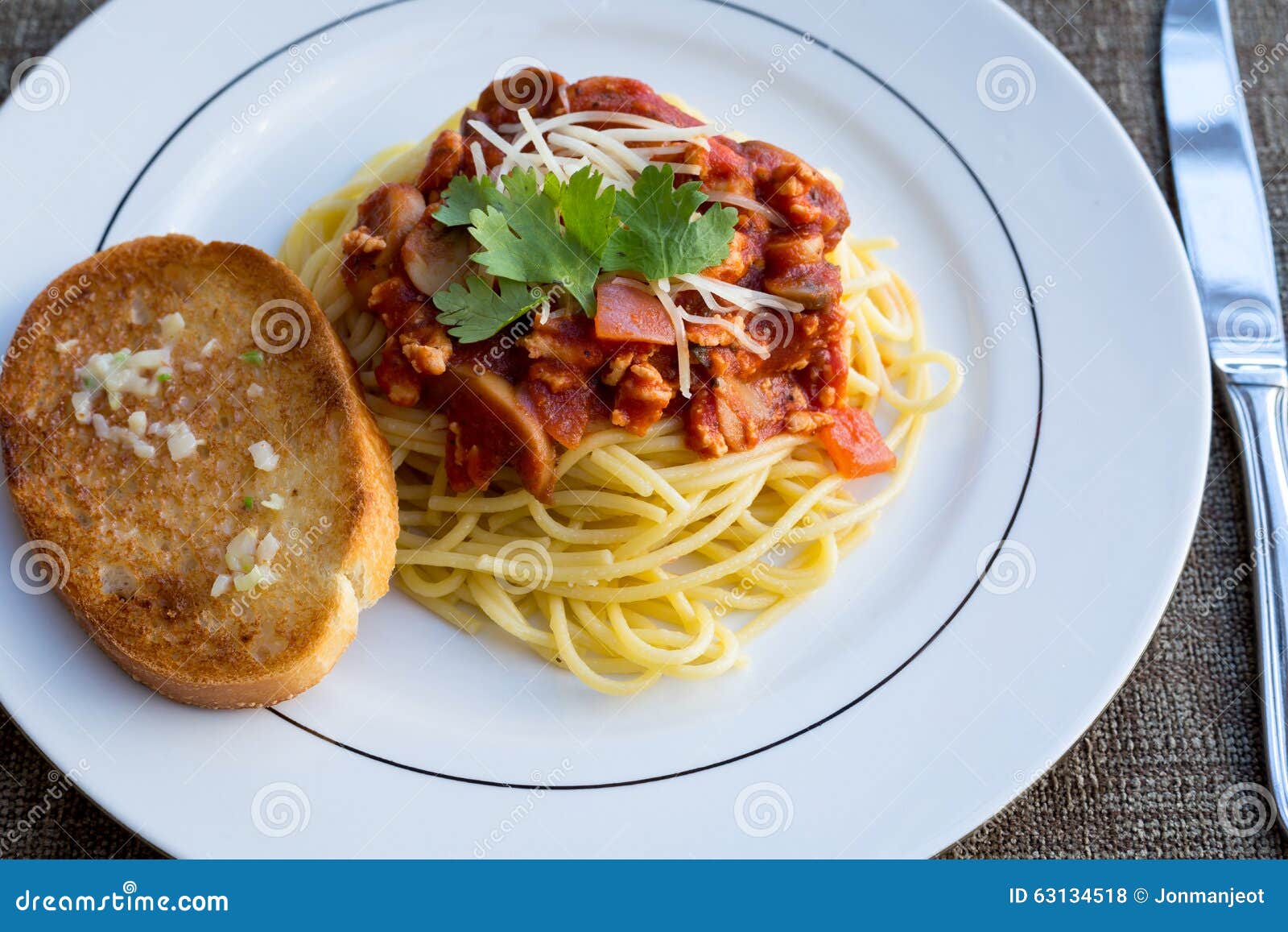 Spaghetti Pasta with Garlic Bread. Stock Photo - Image of pasta, dinner ...