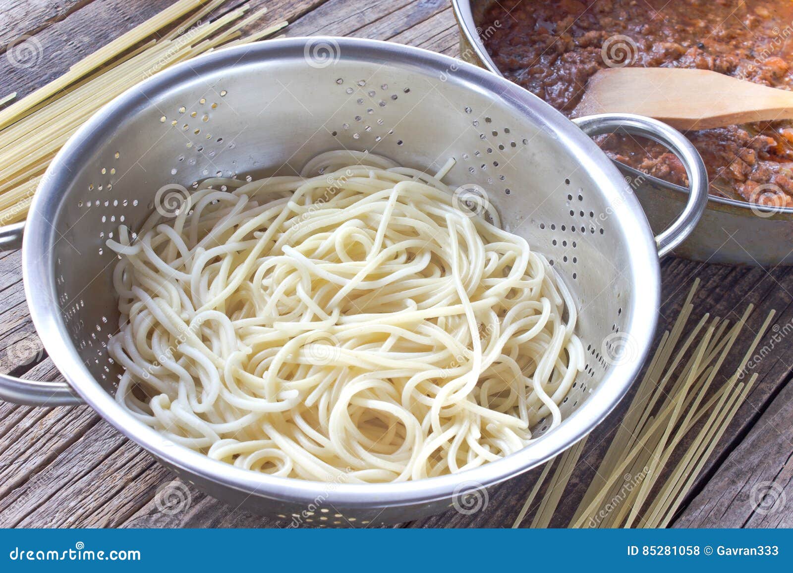 Spaghetti Pasta in Strainer and Bolognese Sauce Stock Photo - Image of ...