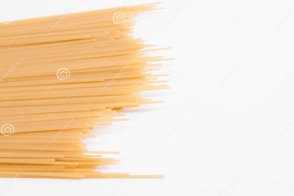 Spaghetti Spread Out on a White Surface Stock Photo - Image of ...