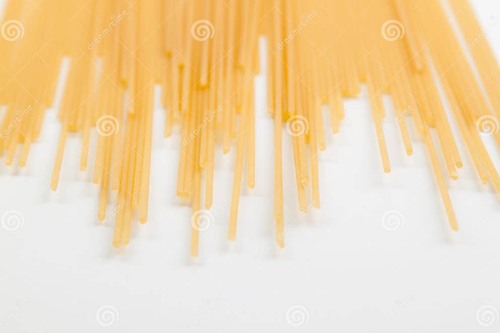 Spaghetti Spread Out on a White Surface Stock Photo - Image of ...
