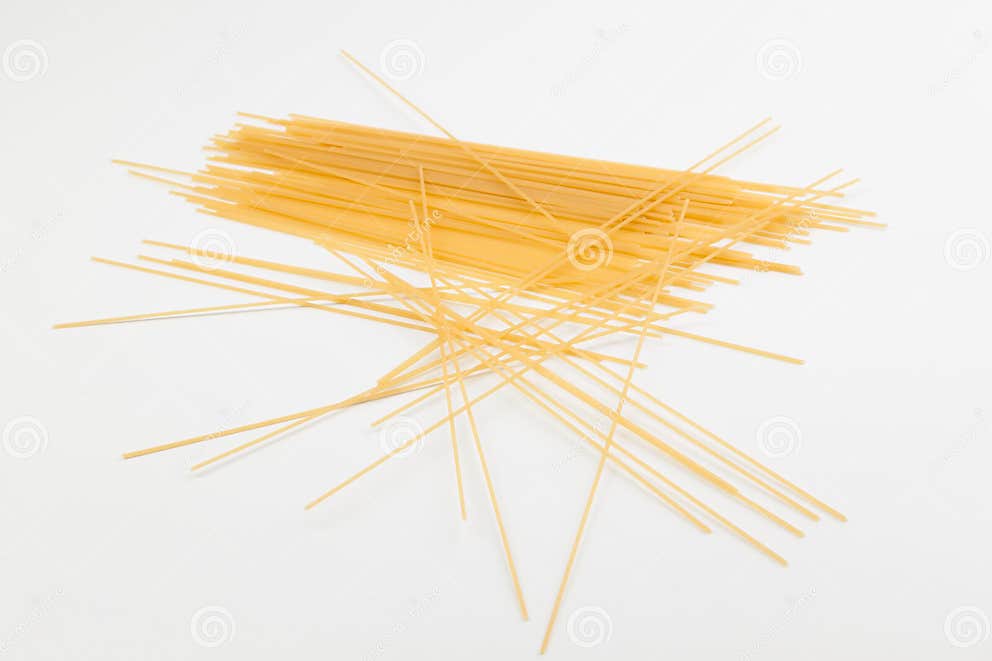 Spaghetti Spread Out on a White Surface Stock Photo - Image of cooking ...