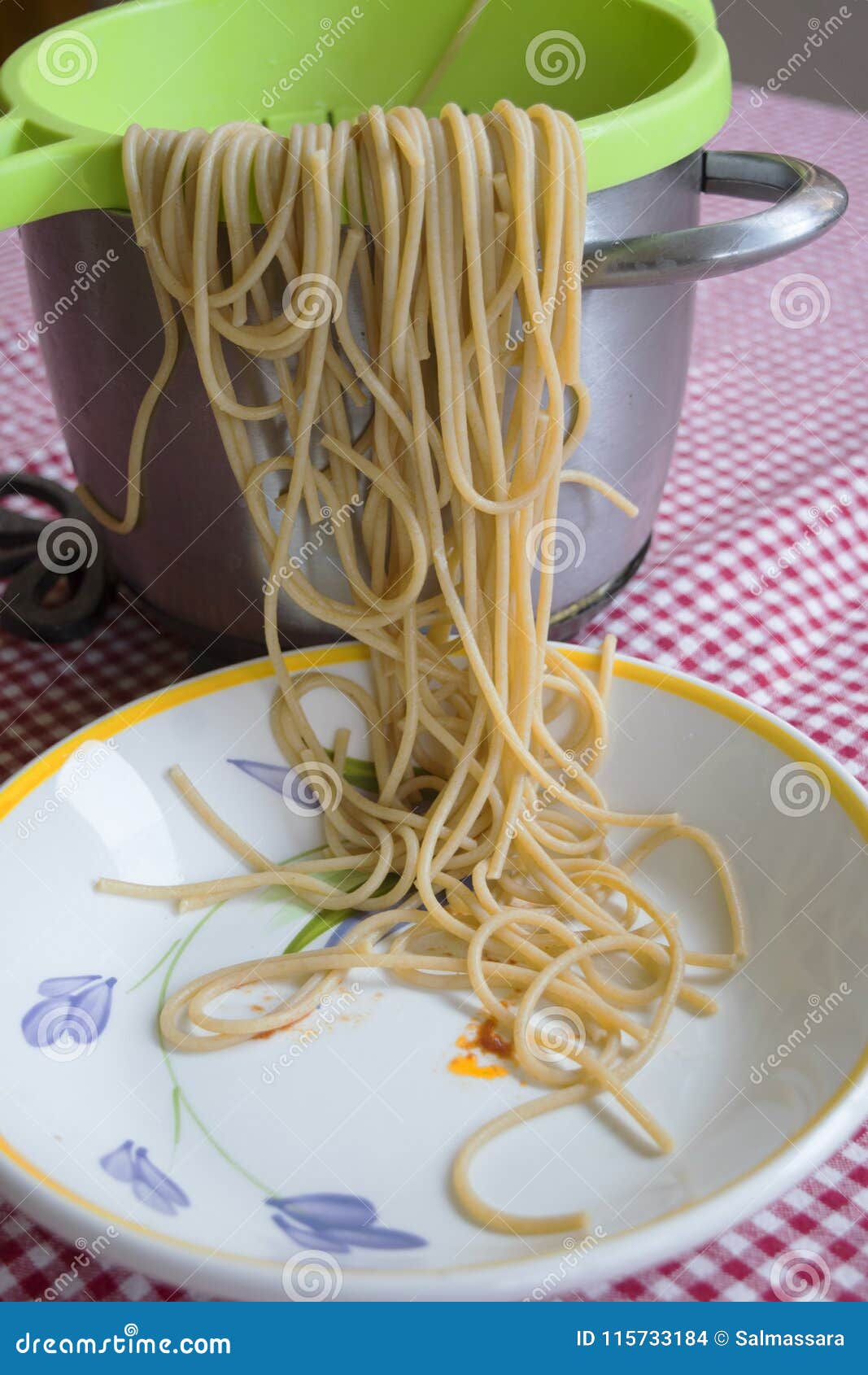 Spaghetti Sticking Out of a Colander and a White Dish Stock Photo ...