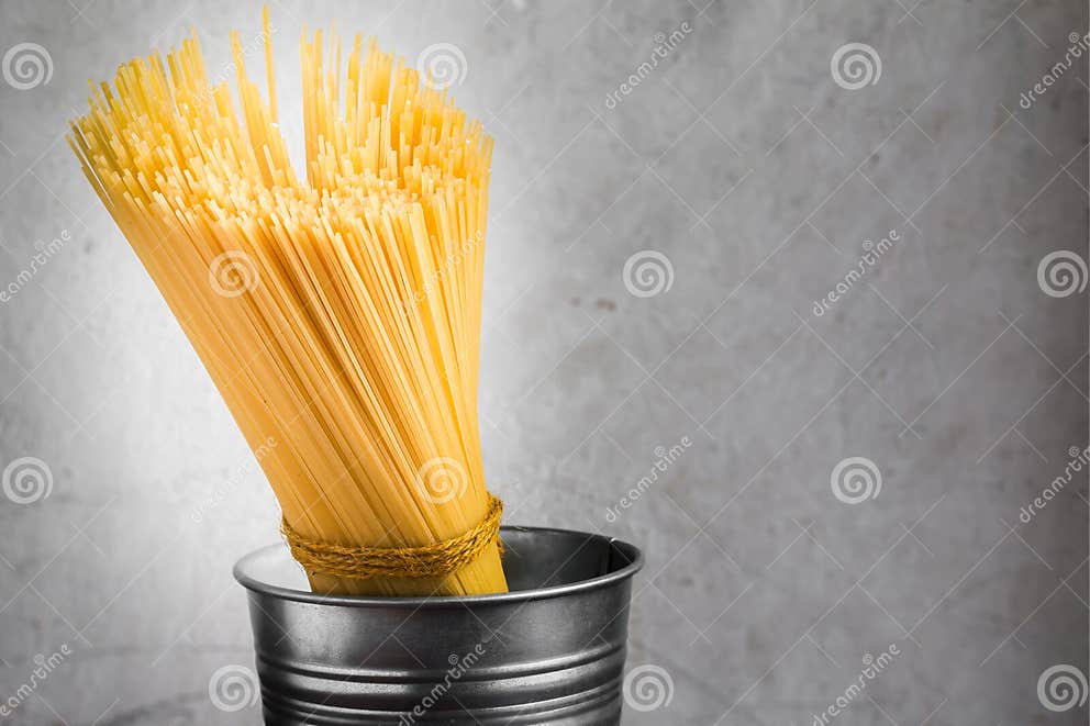 Spaghetti Uncooked in Bucket Stock Photo - Image of package, healthy ...