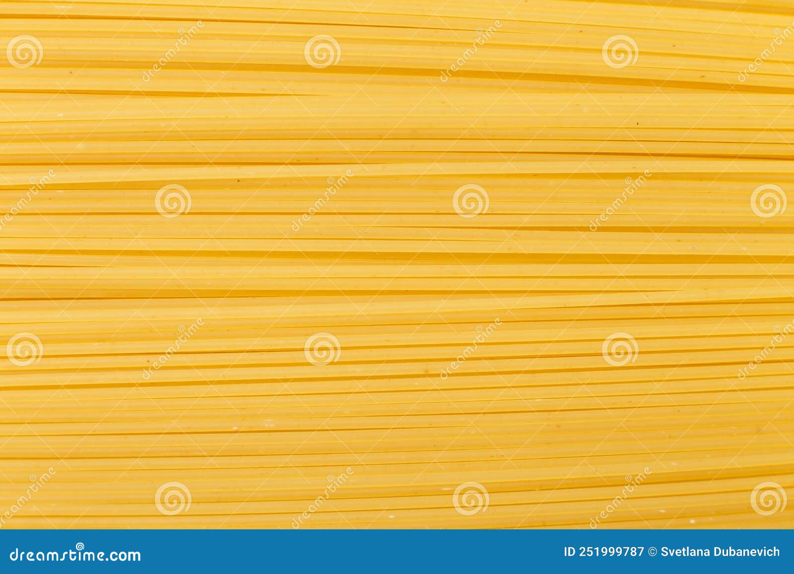 Spaghetti Yellow Background Close. Raw Pasta Macro Stock Image - Image ...