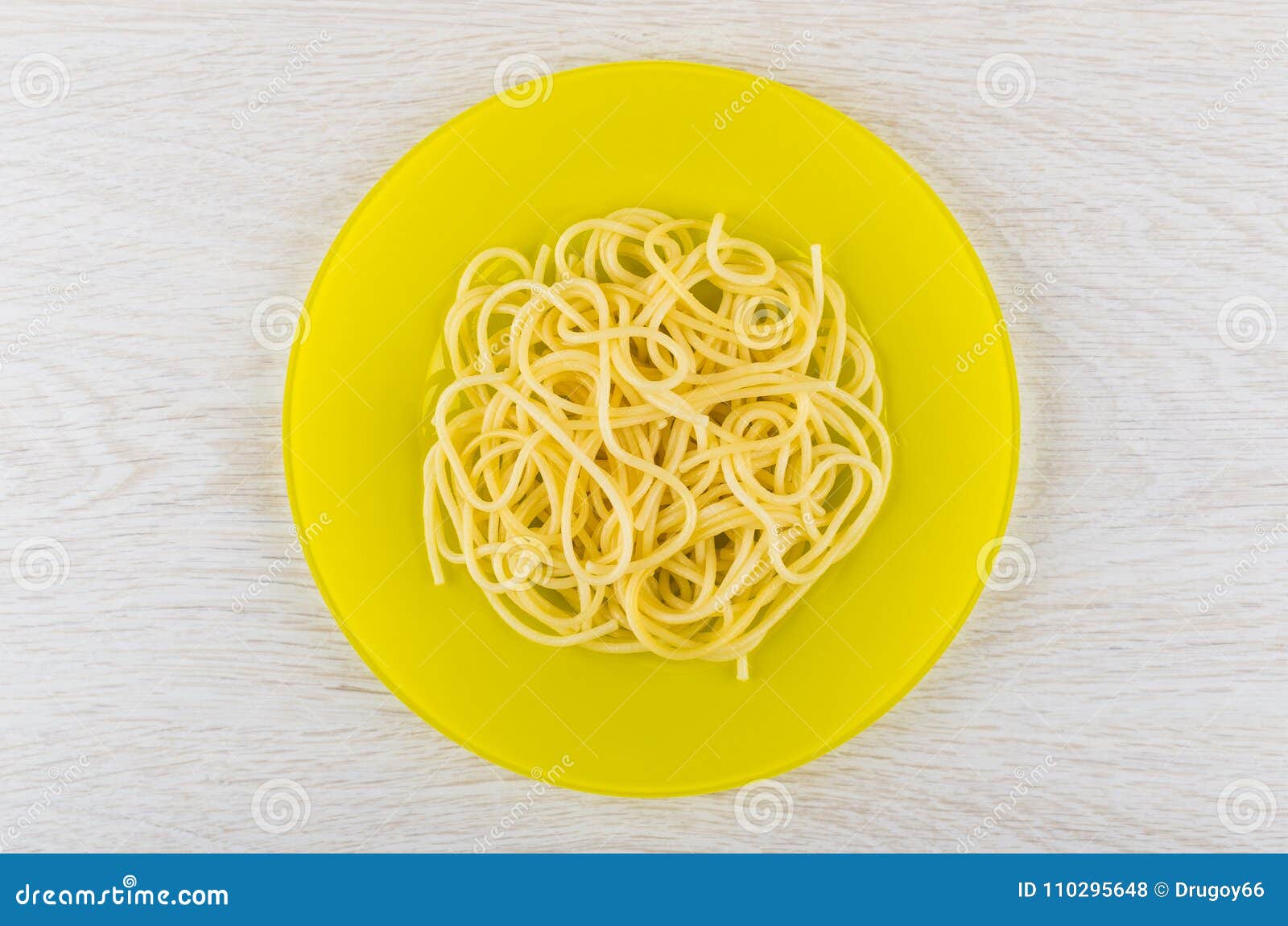 Spaghetti in Yellow Plate on Wooden Table Stock Photo - Image of ...